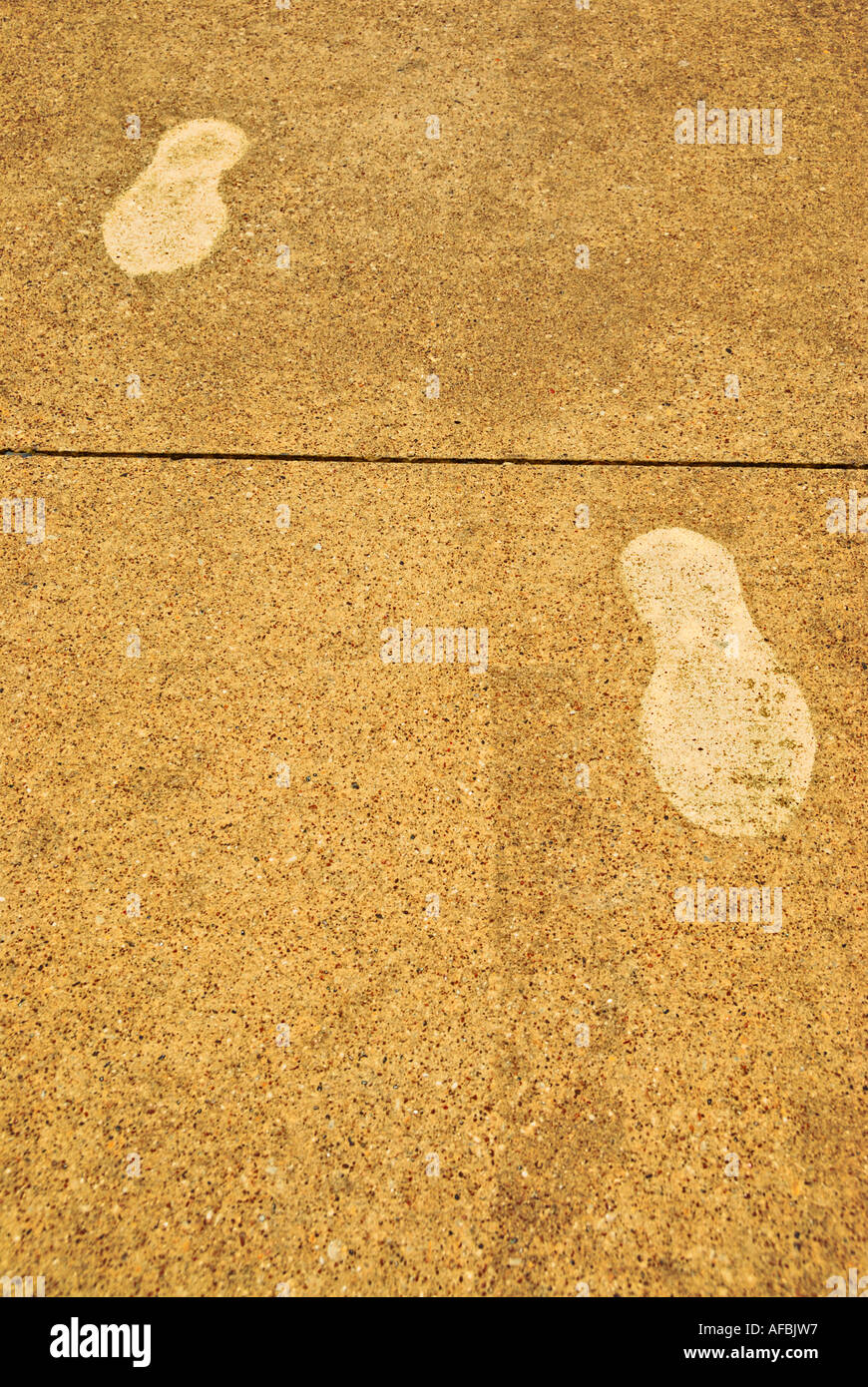 Footprints in Cement Stock Photo - Alamy