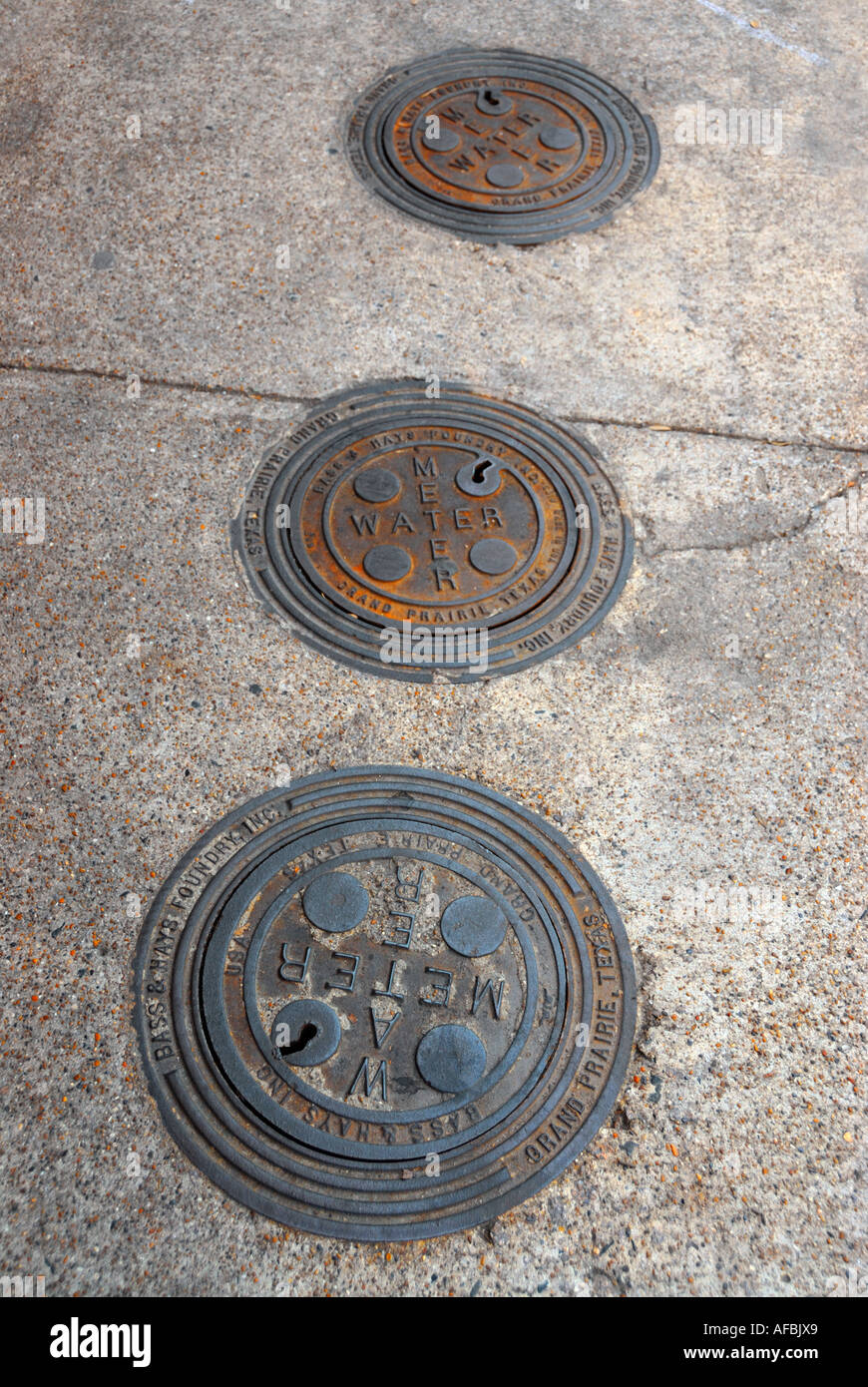 utility Water Meter 3 in a row Stock Photo - Alamy