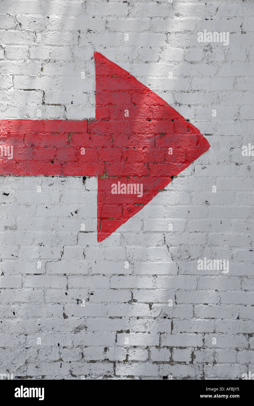 Red Arrow on Wall 3 Stock Photo - Alamy