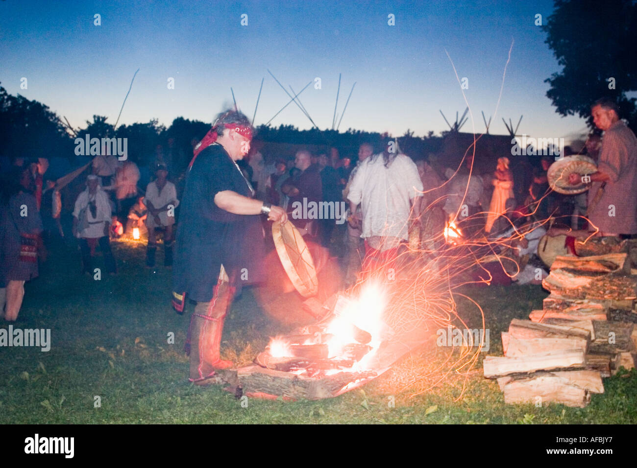 Native American reenactors in period costume dress powwow campfire ...
