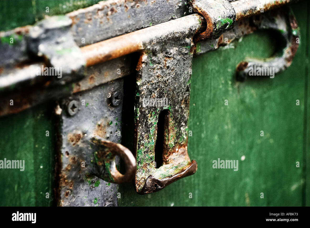 Rusty Green Lock Bolting Shut a Door Stock Photo - Alamy