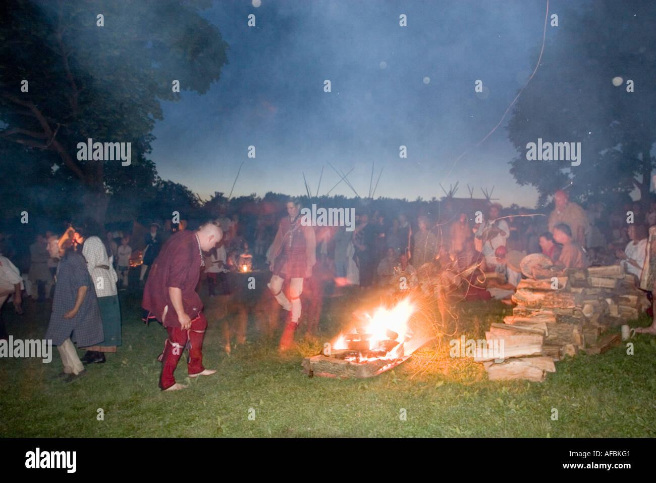Native American reenactors in period costume dress powwow campfire ...