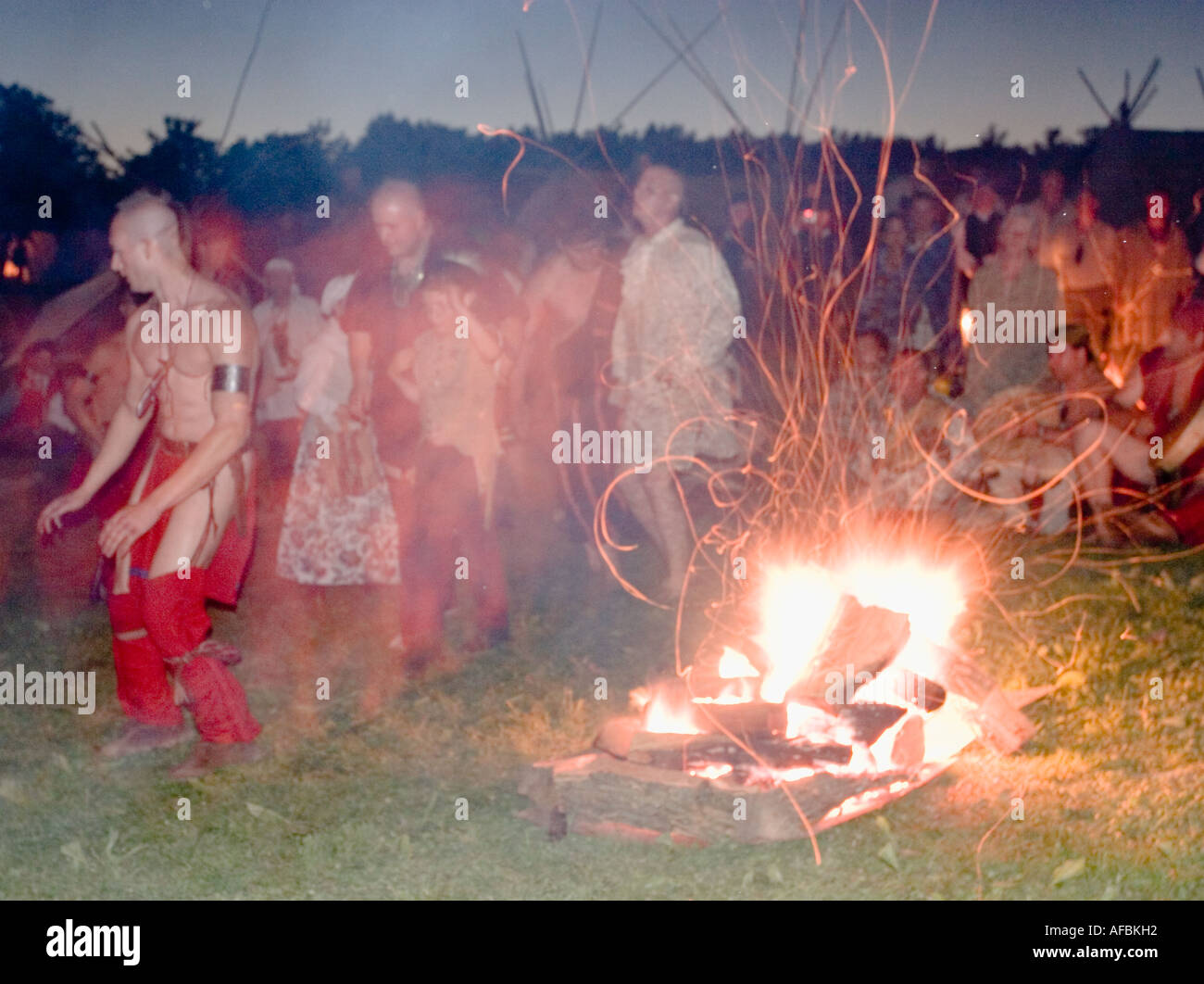 Native American reenactors in period costume dress powwow campfire ...