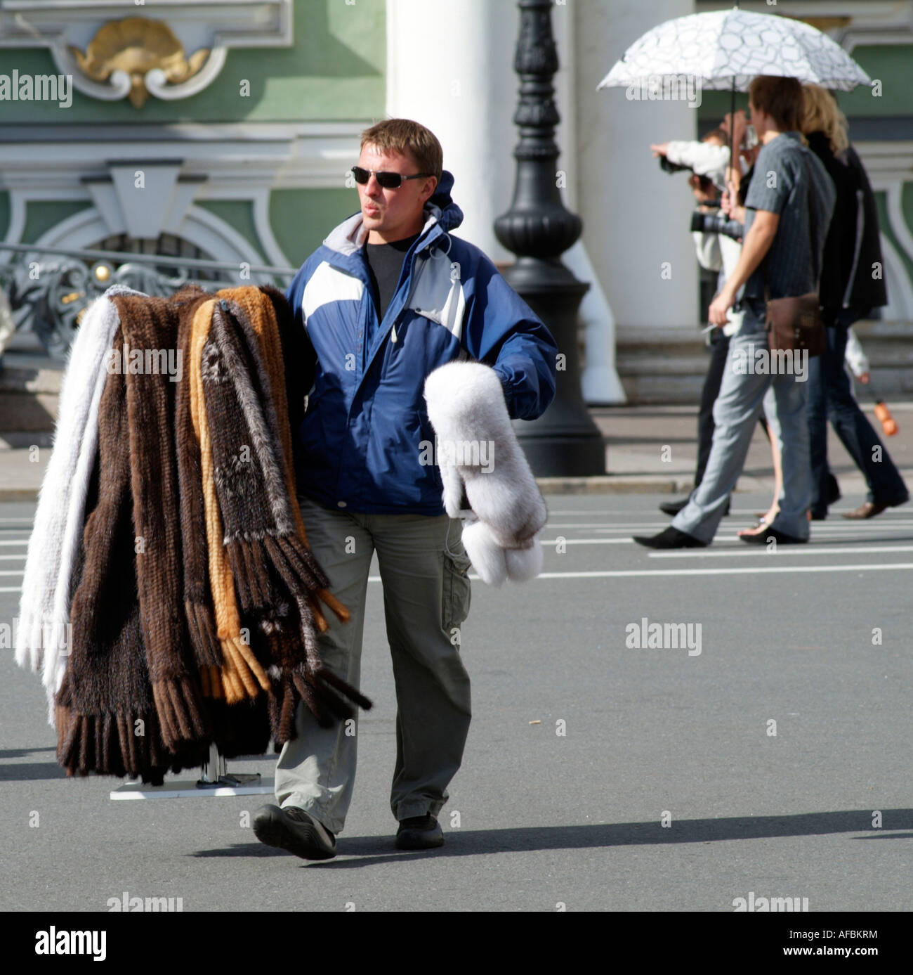 Trader selling fur wraps on Palace Square in St Petersburg Russia Stock ...