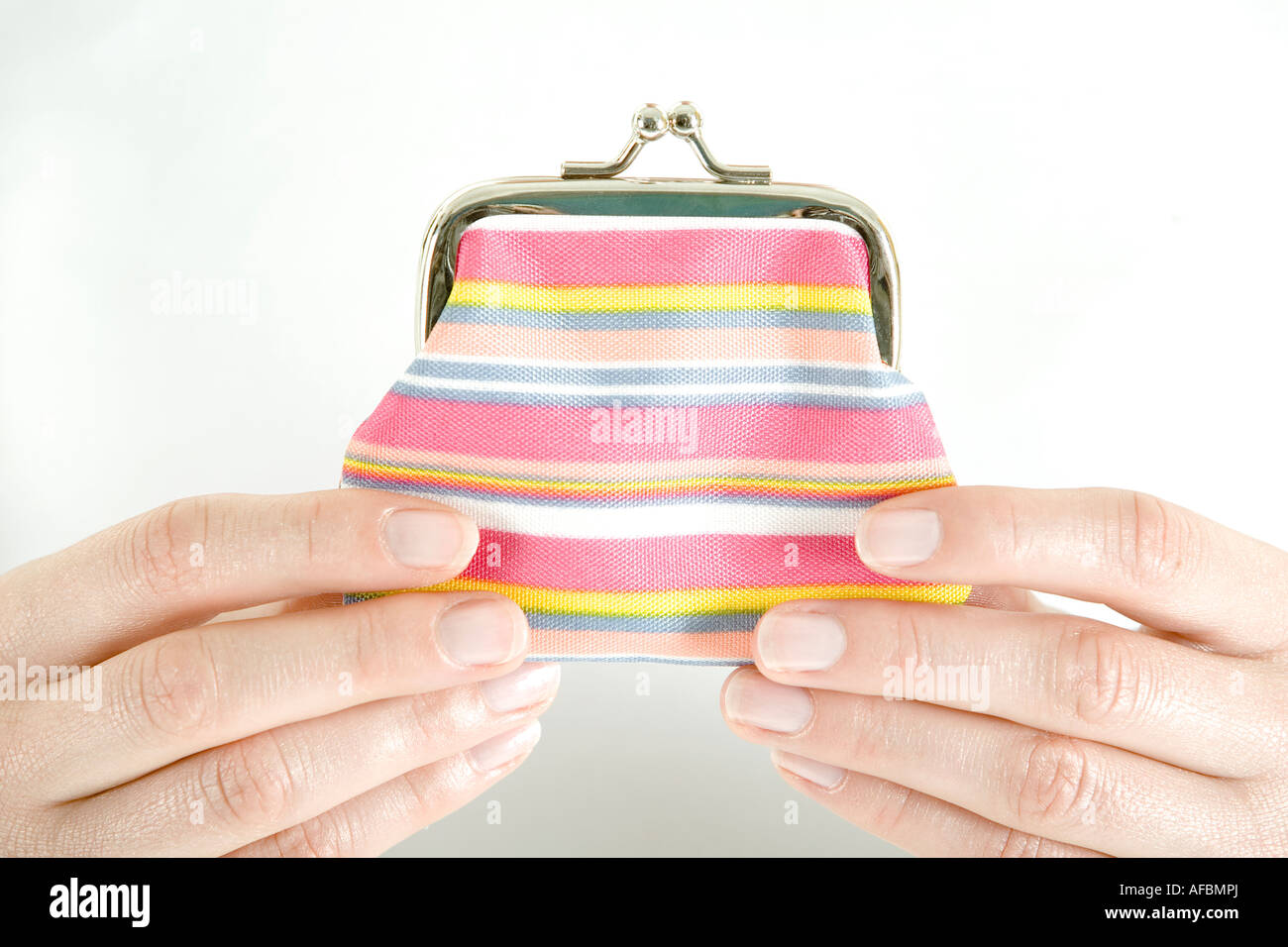 Hand holding purse, close-up Stock Photo - Alamy