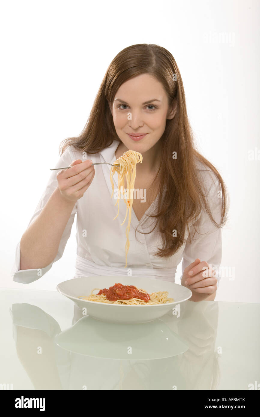 Woman eating noodles, portrait Stock Photo - Alamy