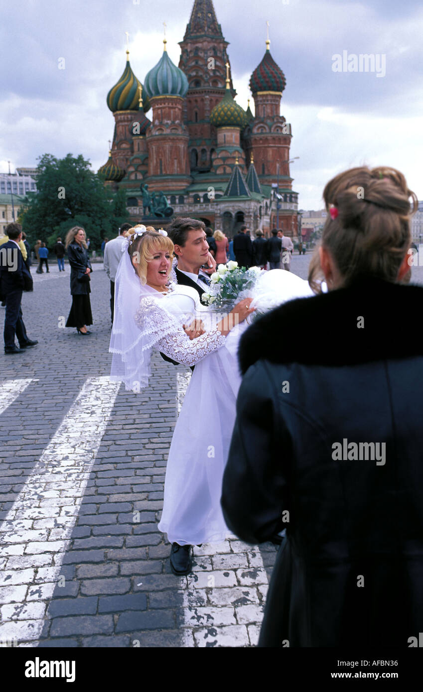 Moscow a wedding couple at red square to have pictures taken in front ...