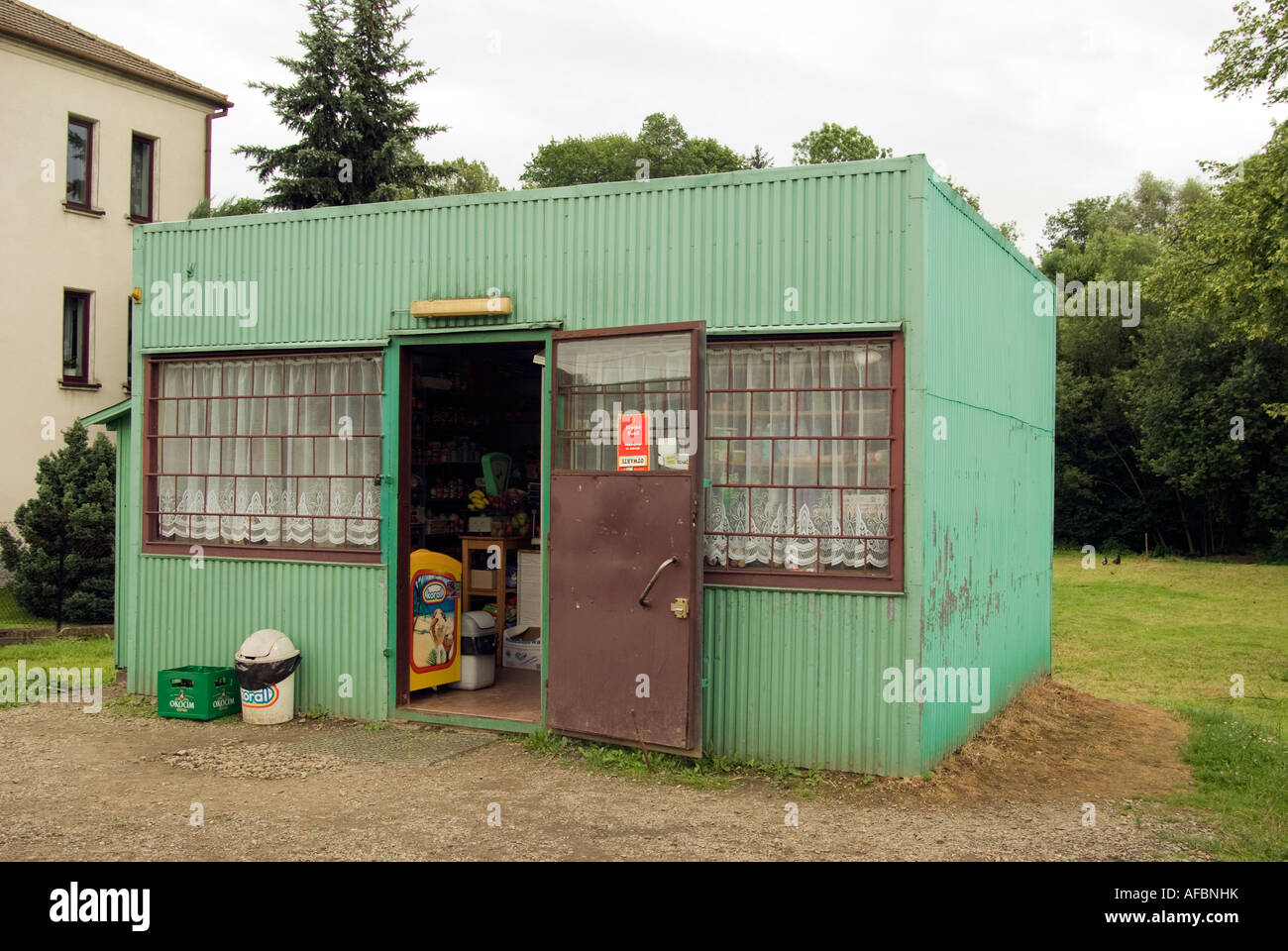 A one-room free-standing grocery store made from green corrugated metal ...