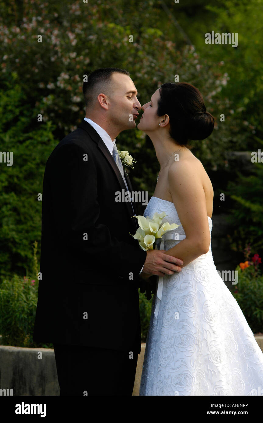The bride and groom kissing Stock Photo - Alamy
