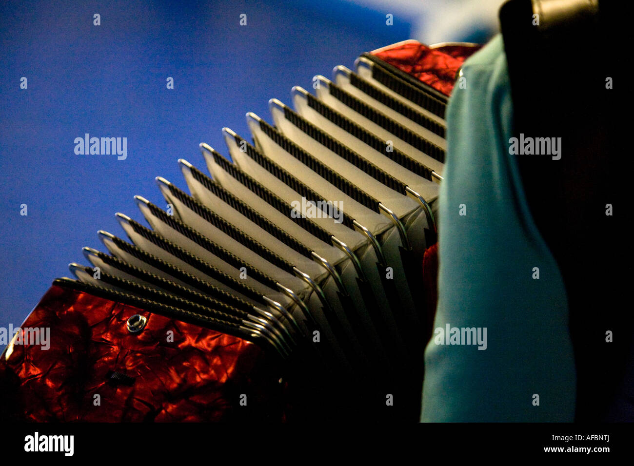 Piano accordion being played by a folk musician during a folk dance ...
