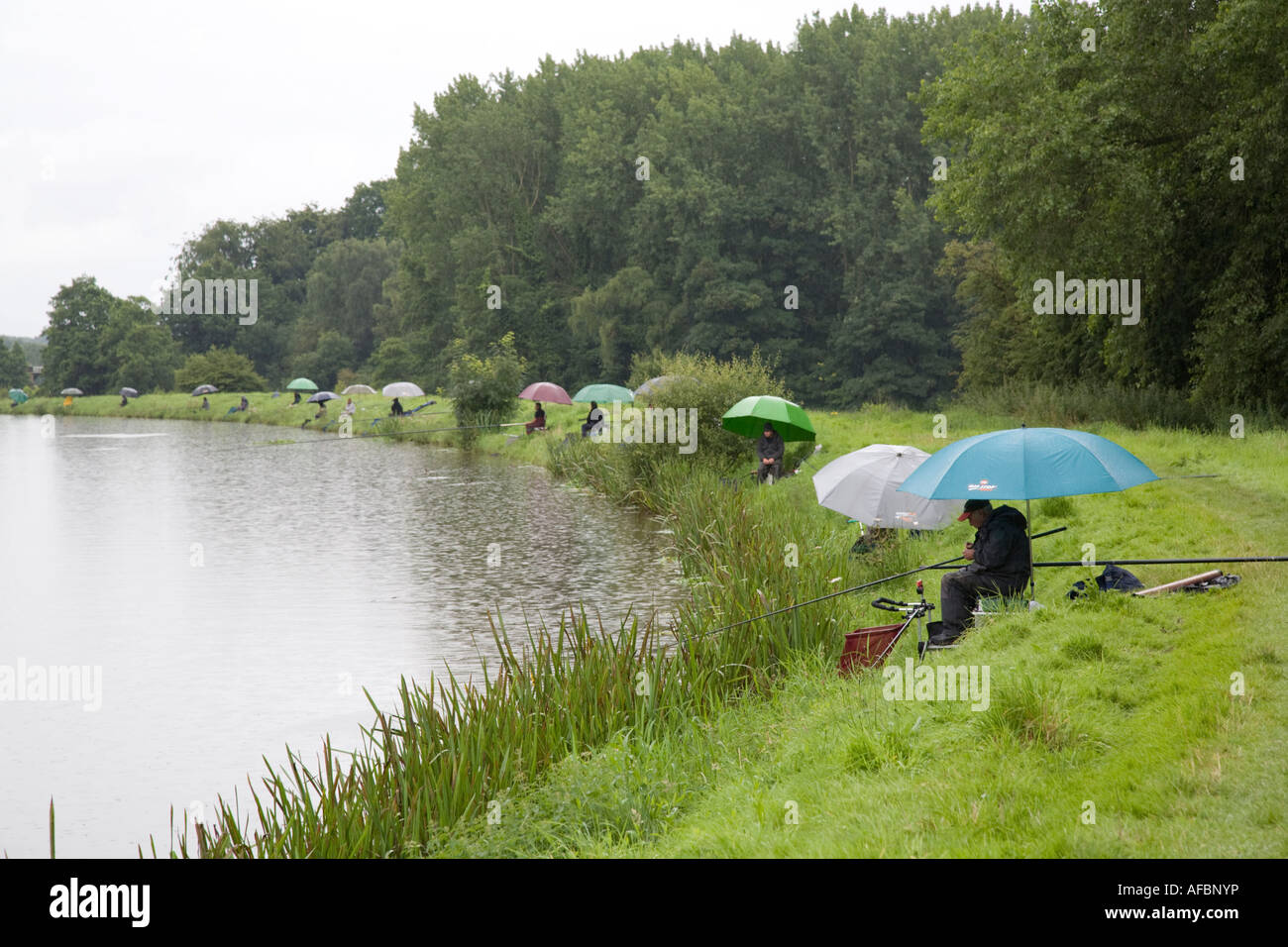Fishing competition in the rain along the River Weaver Cheshire Stock ...