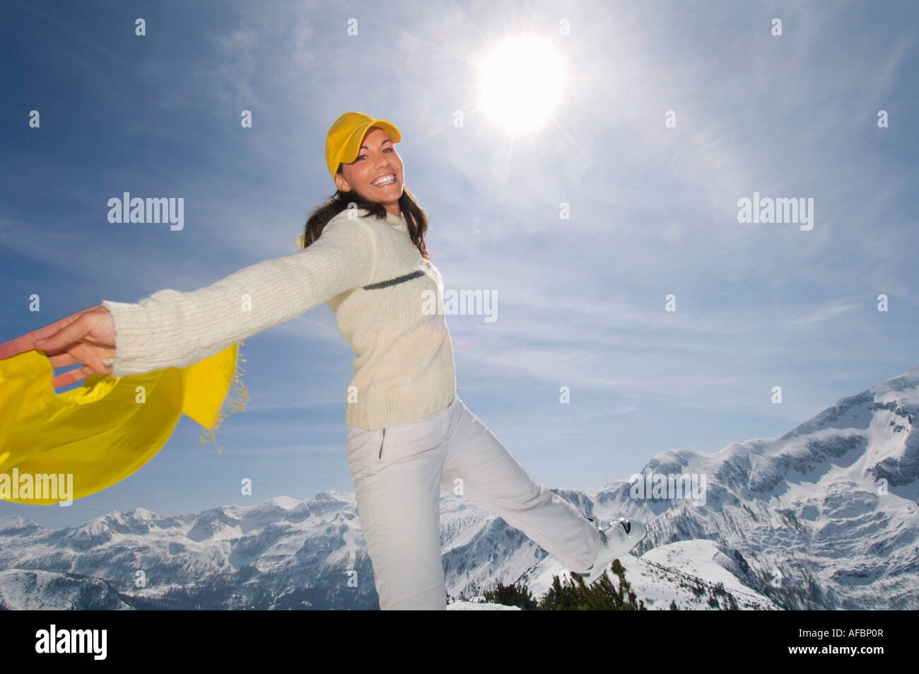 Woman in mountains, holding cape Stock Photo - Alamy