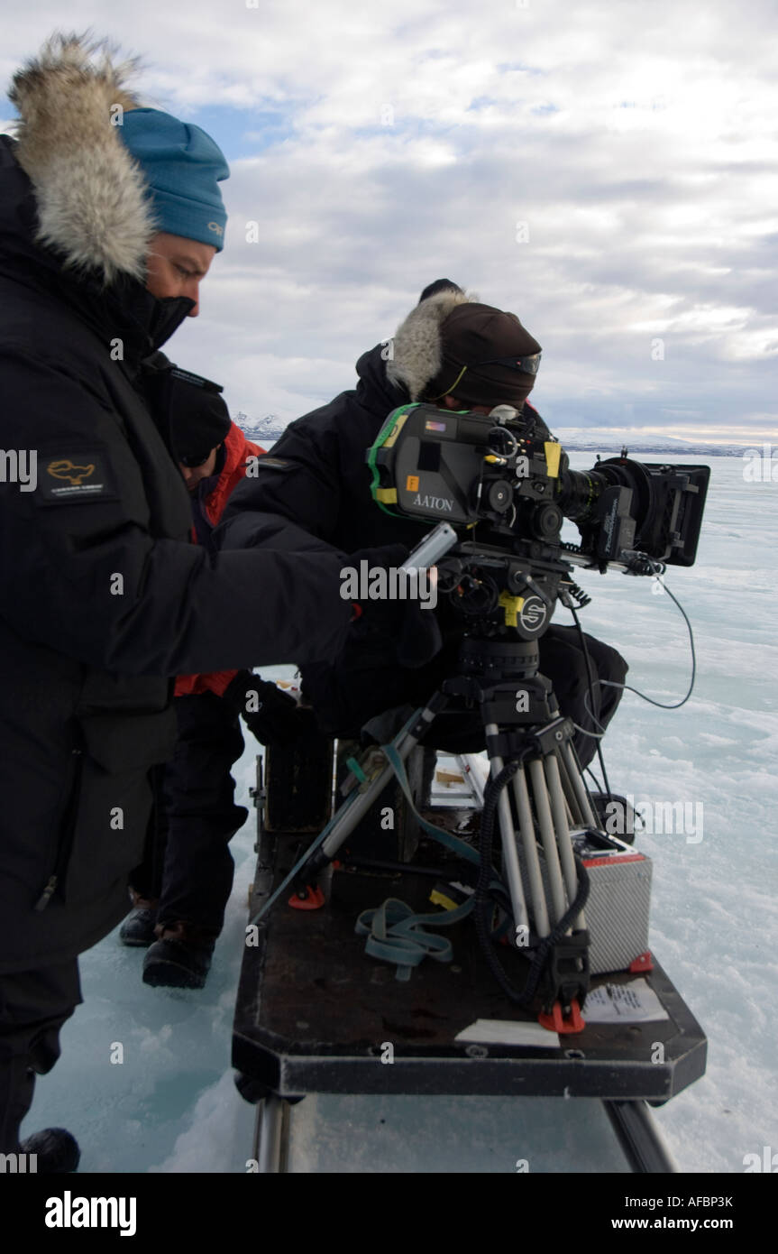 Film crew working in the high arctic movie camera on rails and dolly ...