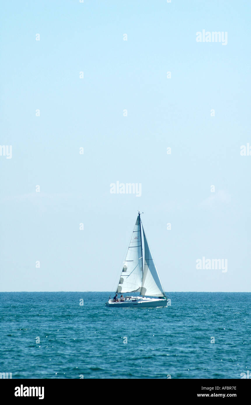 Sailing boat out at sea Stock Photo - Alamy