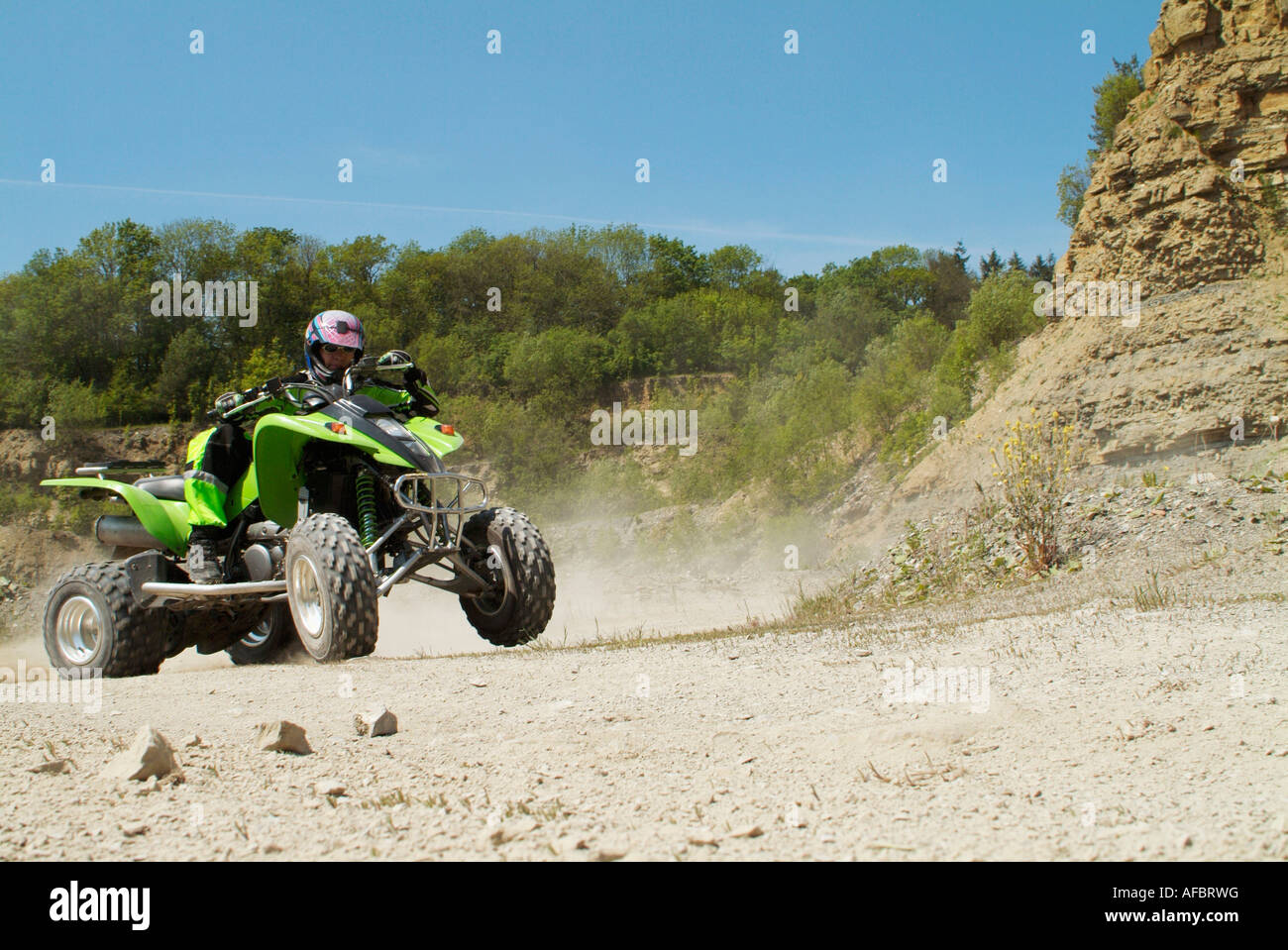 Man riding quad bike Stock Photo - Alamy