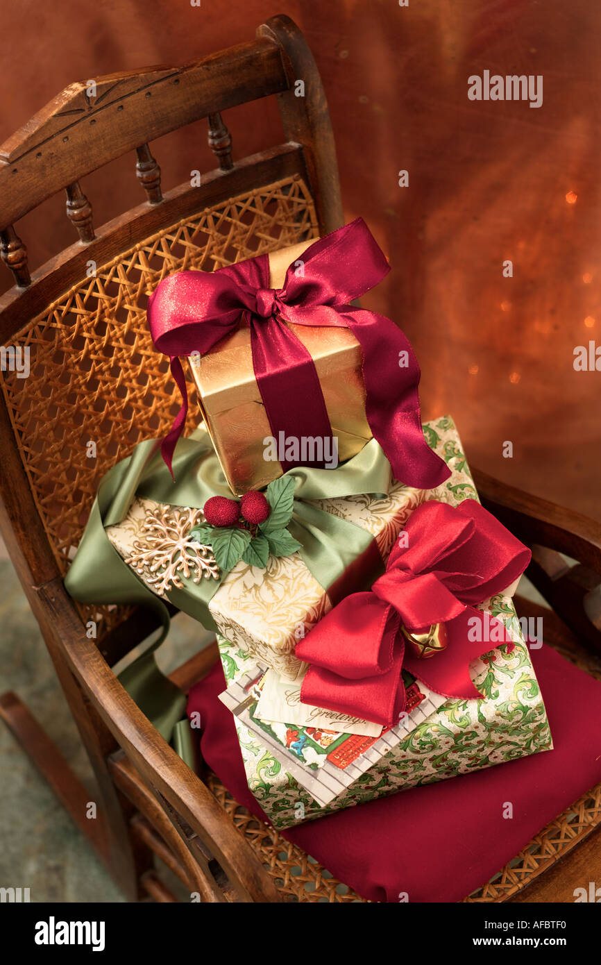 Holiday Gifts on Rocking Chair Stock Photo - Alamy