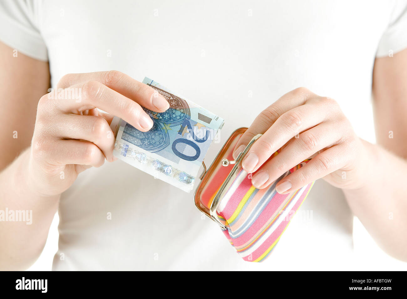 Woman putting money in change purse, close-up Stock Photo - Alamy
