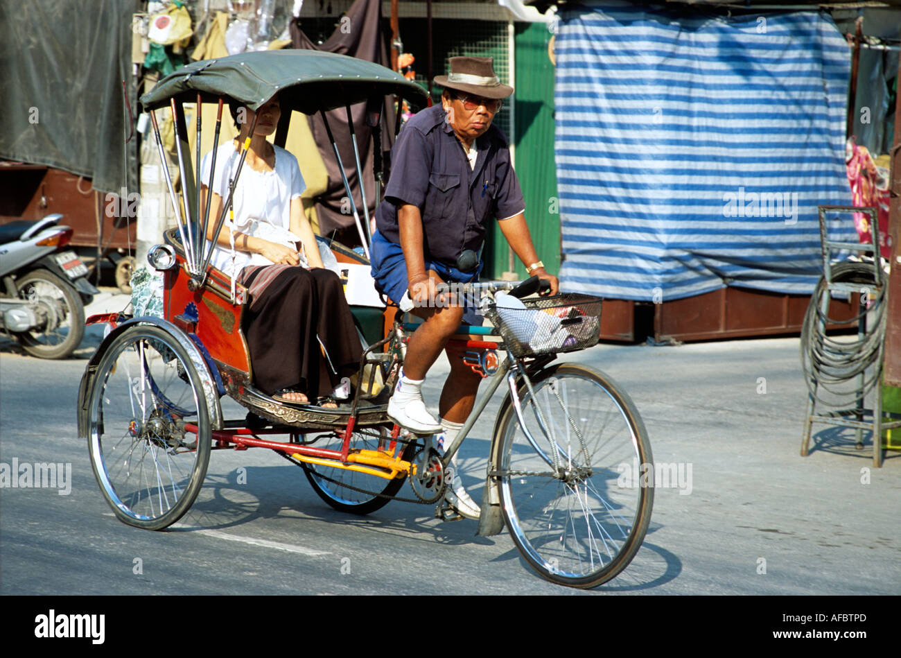Bicycle rickshaw driver and passenger, Chiang Mai, Thailand Stock Photo ...