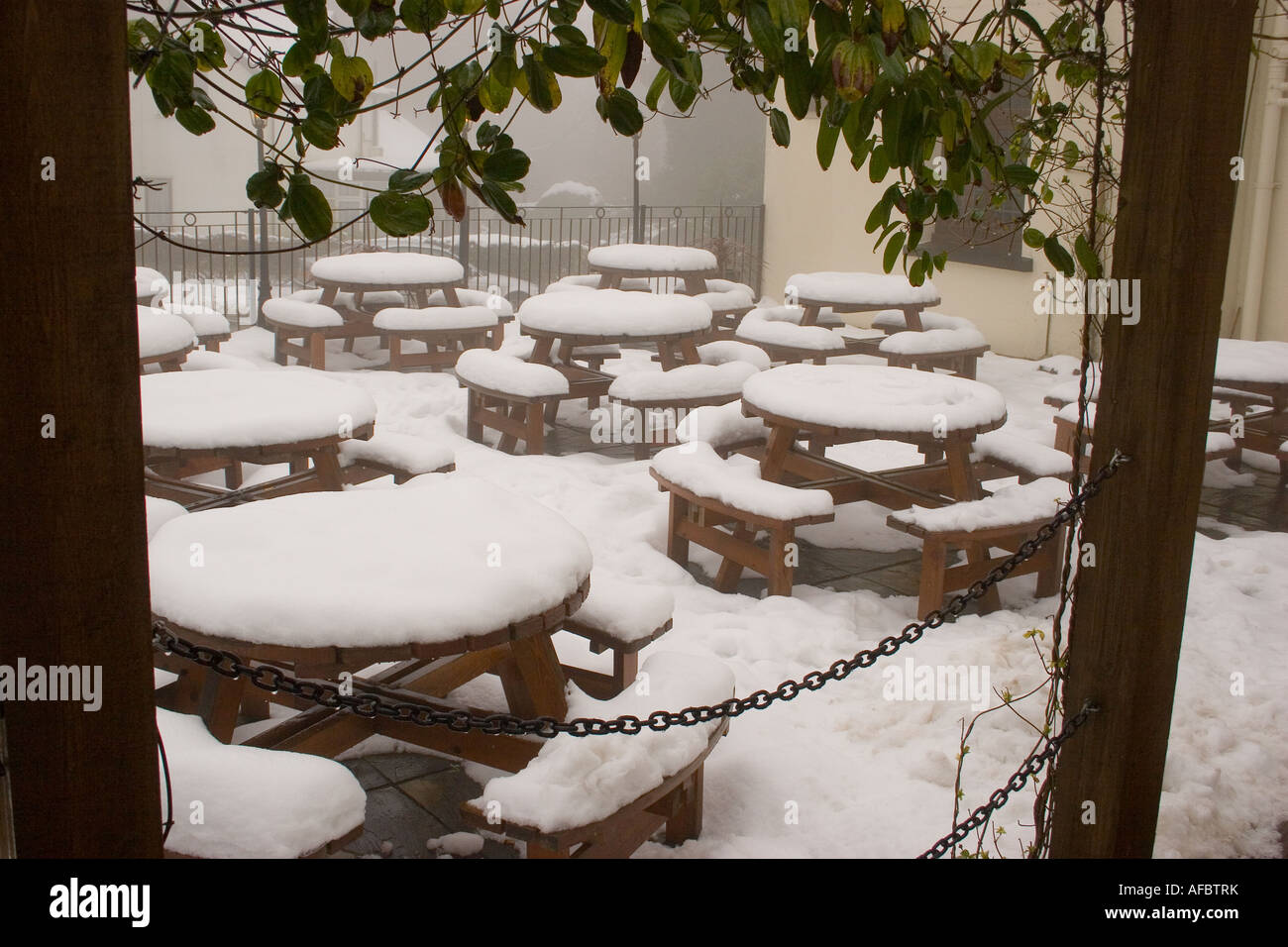 A Pub snowed in Stock Photo - Alamy