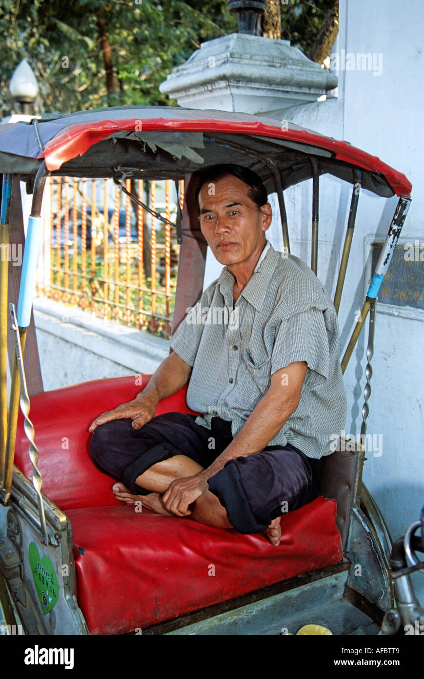 Rickshaw driver sitting in rickshaw, Chiang Mai, Thailand Stock Photo ...