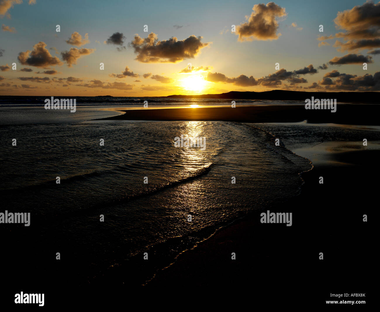 sunset beach scene islay argyll Stock Photo - Alamy
