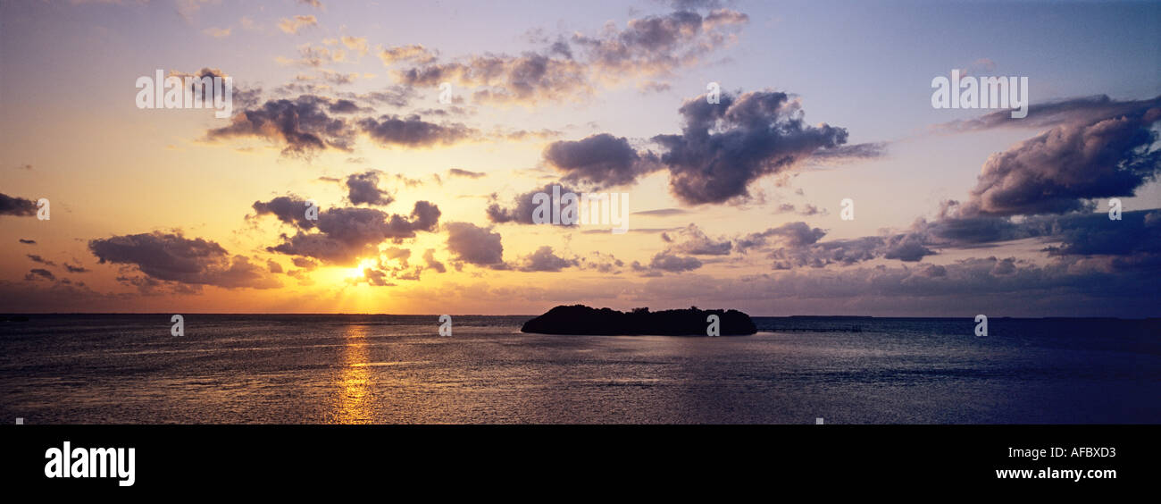 Island floats in shimmering sea at sunset Marathon Key Florida Keys ...