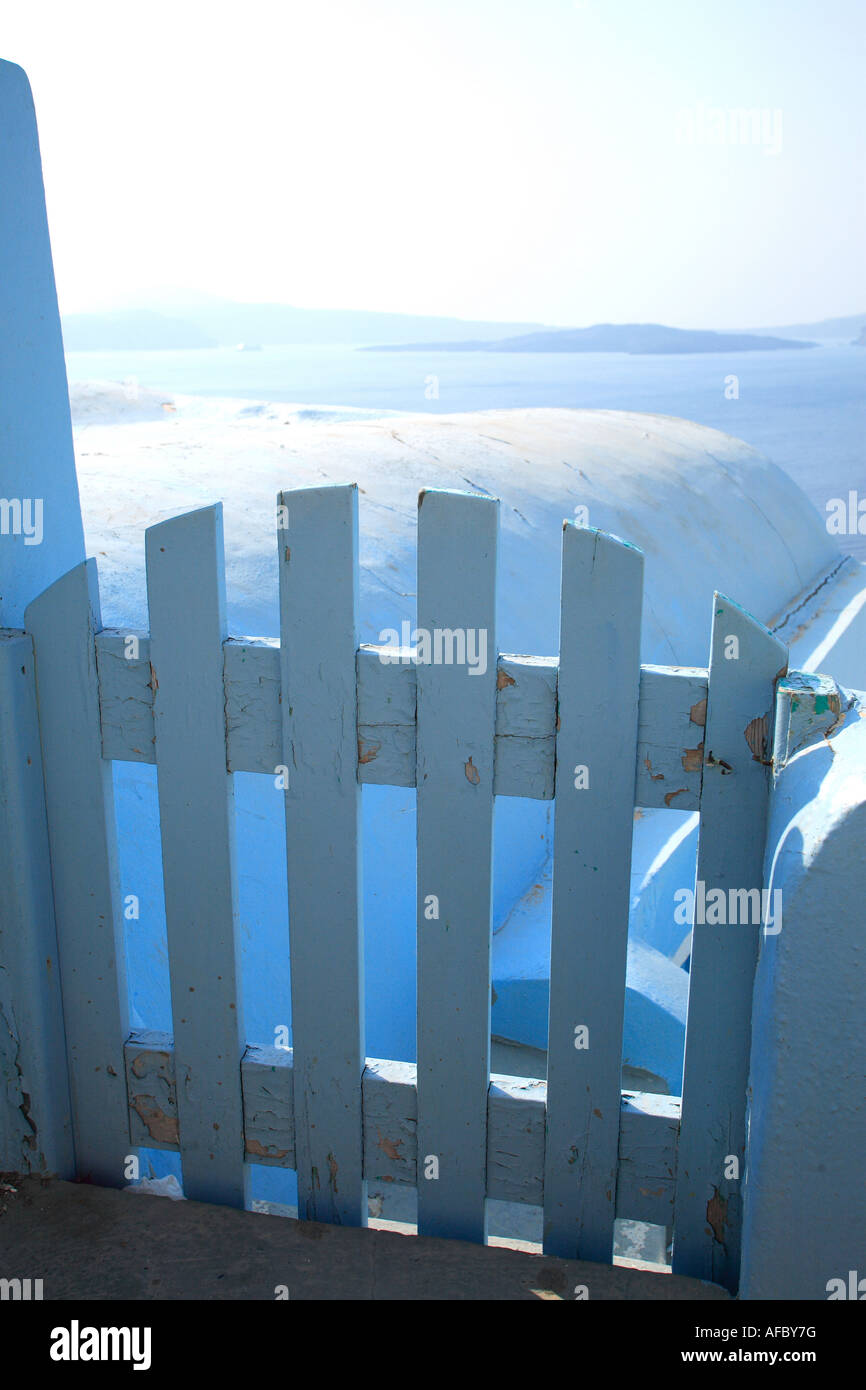blue timber gate overlooking the aegian sea in santorini greece Stock ...