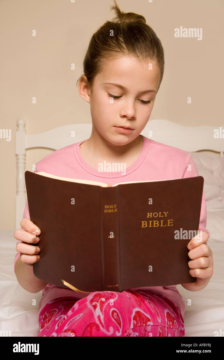 Girl reading the Holy Bible Stock Photo - Alamy