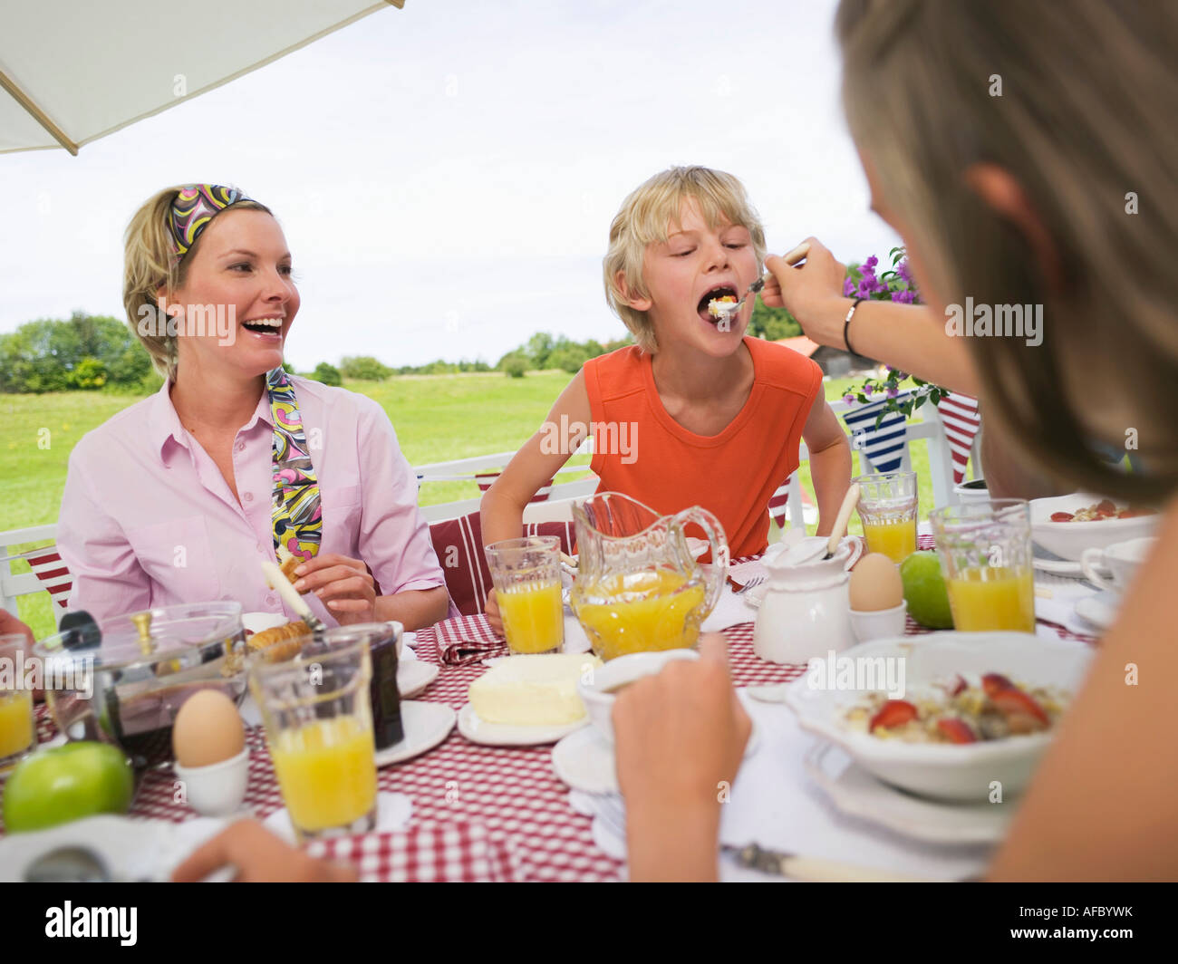 Family at breakfast table Stock Photo - Alamy
