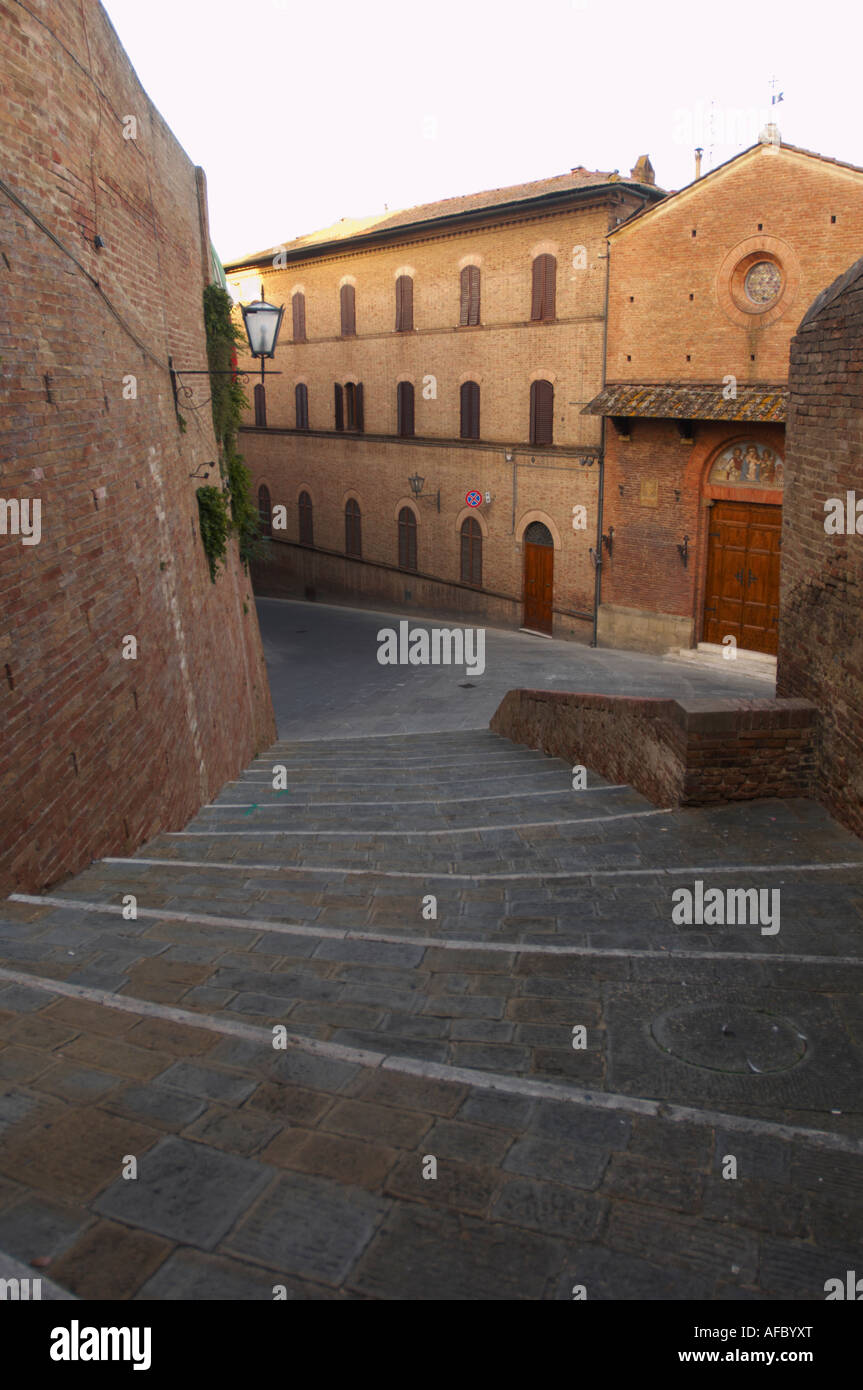Steps leading down to a street in Siena, Italy Stock Photo - Alamy