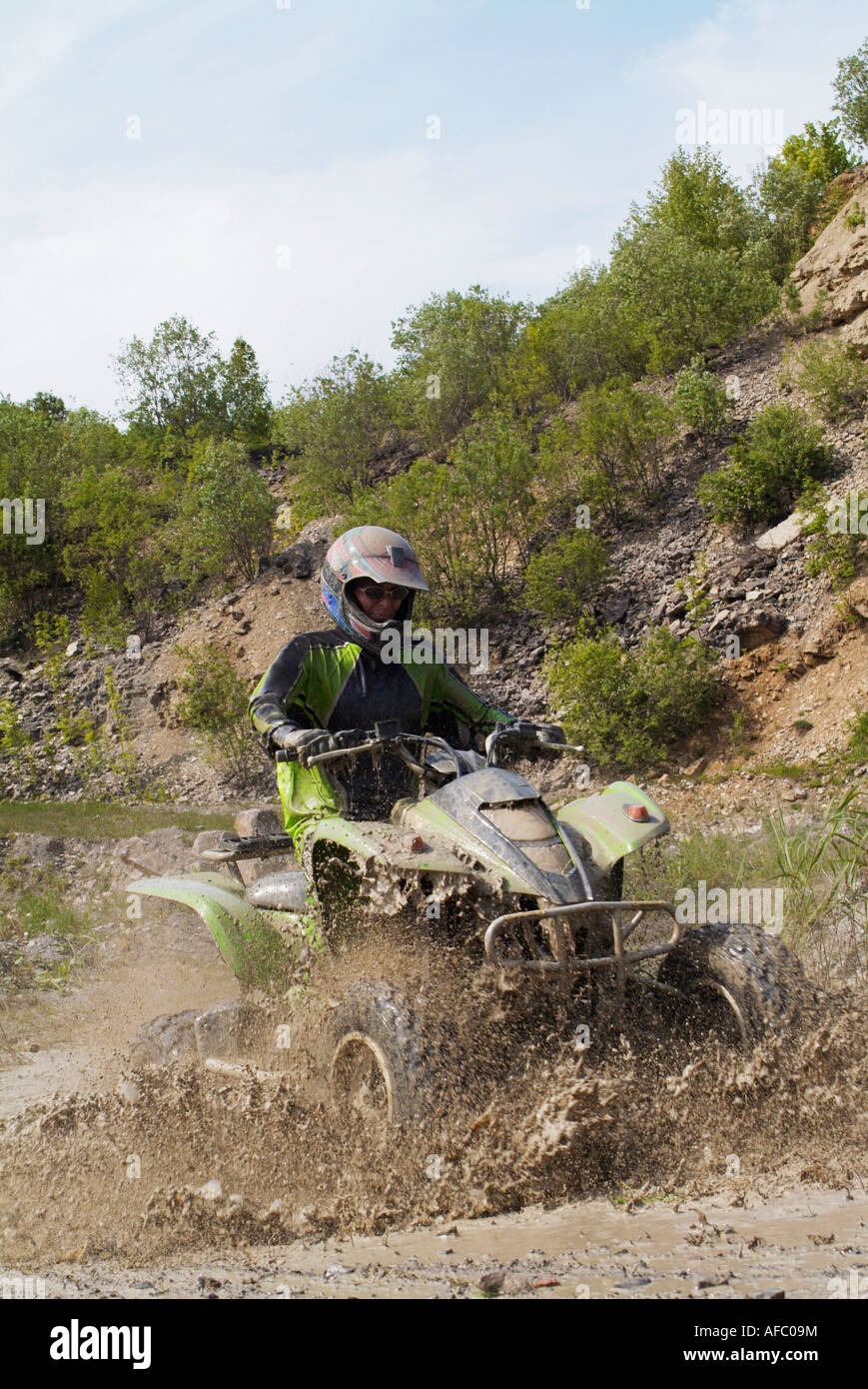 Man riding quad bike Stock Photo - Alamy