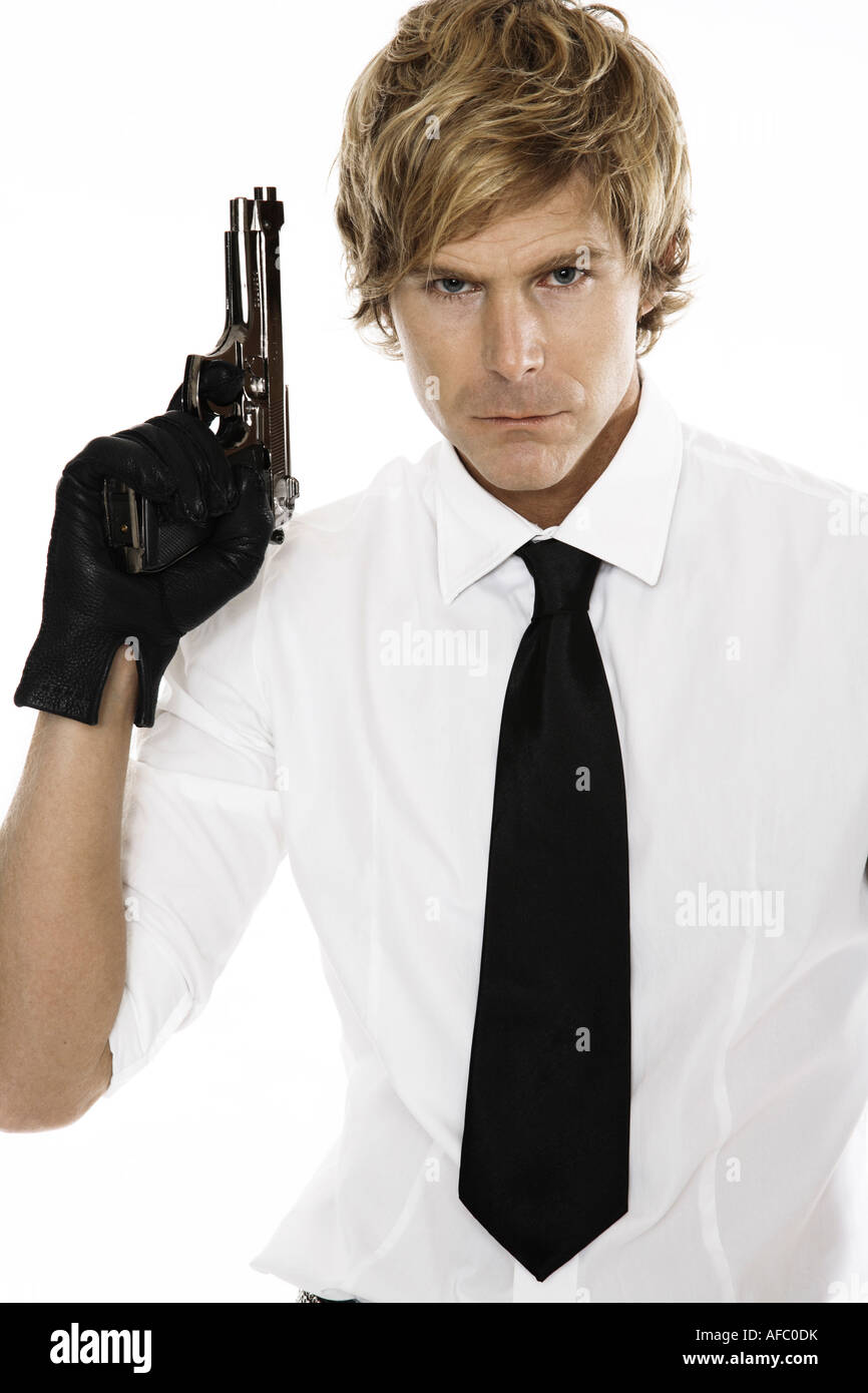 Man holding gun, close-up Stock Photo - Alamy