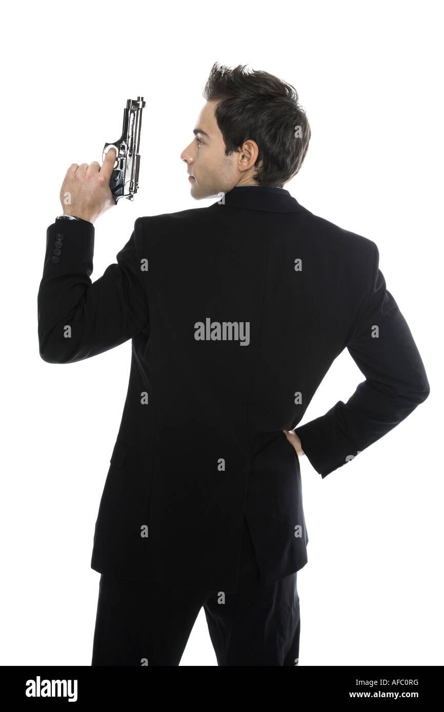Man Suit Gun Stock Photos & Man Suit Gun Stock Images - Alamy