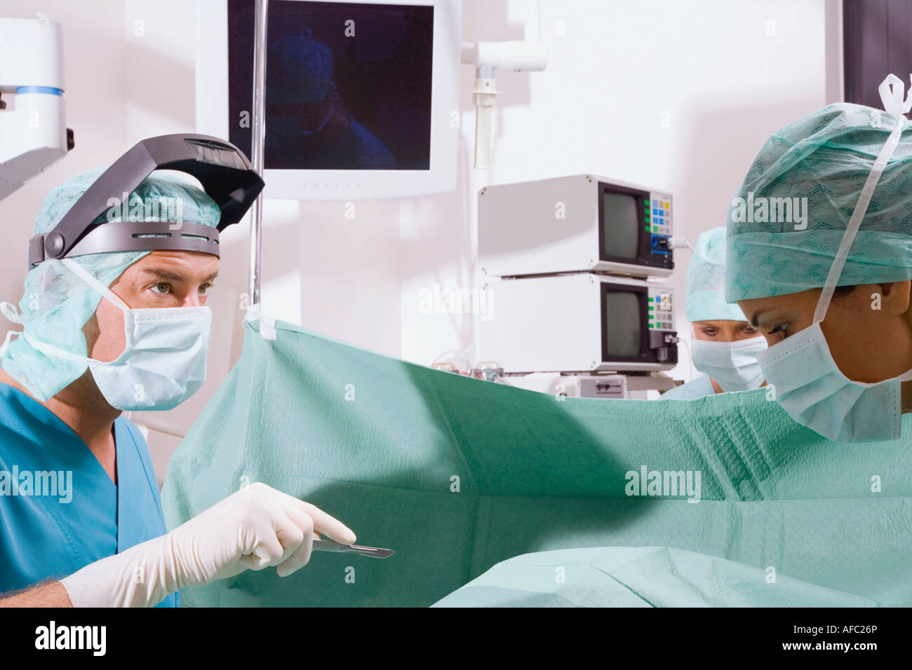 Surgery team in the operating room Stock Photo - Alamy