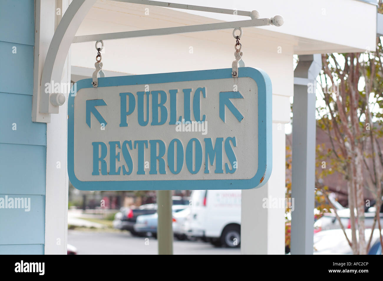 Public restrooms sign with mostly white and blue Stock Photo - Alamy