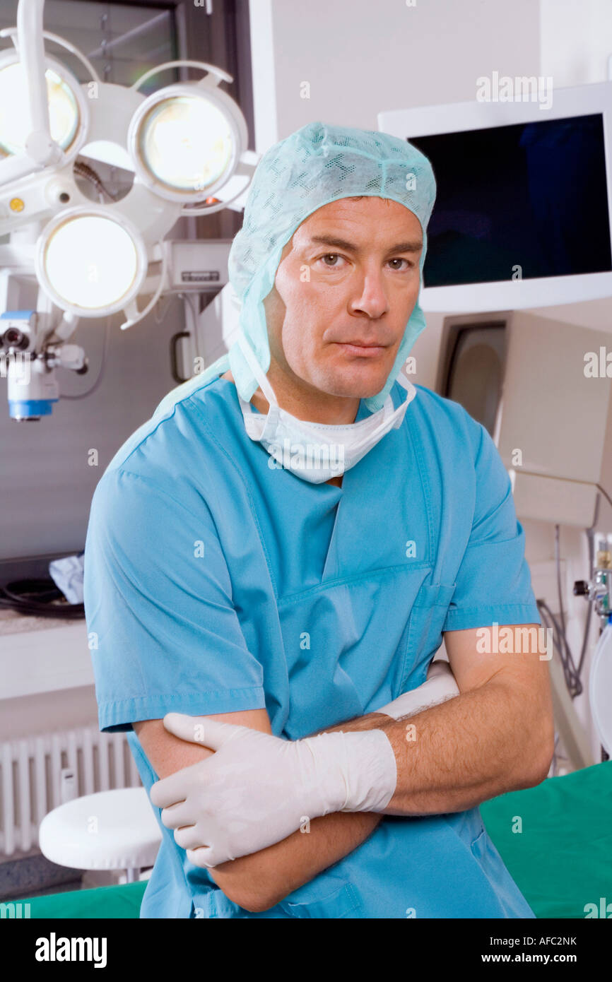 Surgeon sitting on operating table Stock Photo - Alamy