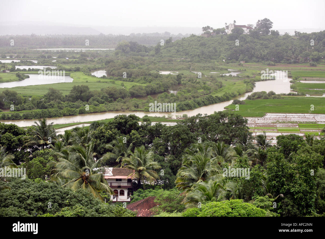 Batim village and background of prawn farms during monsoon used as salt ...
