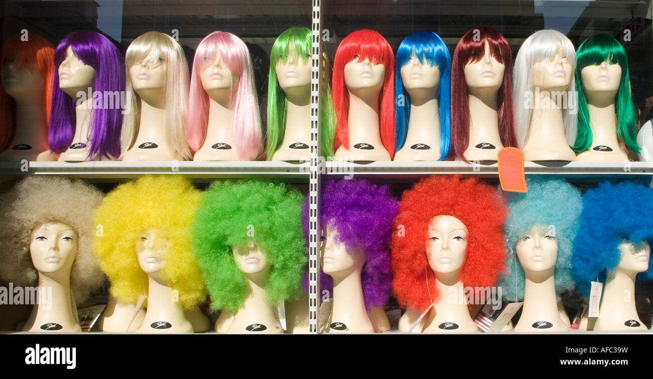 a display of elaborate wigs in a shop window Stock Photo - Alamy