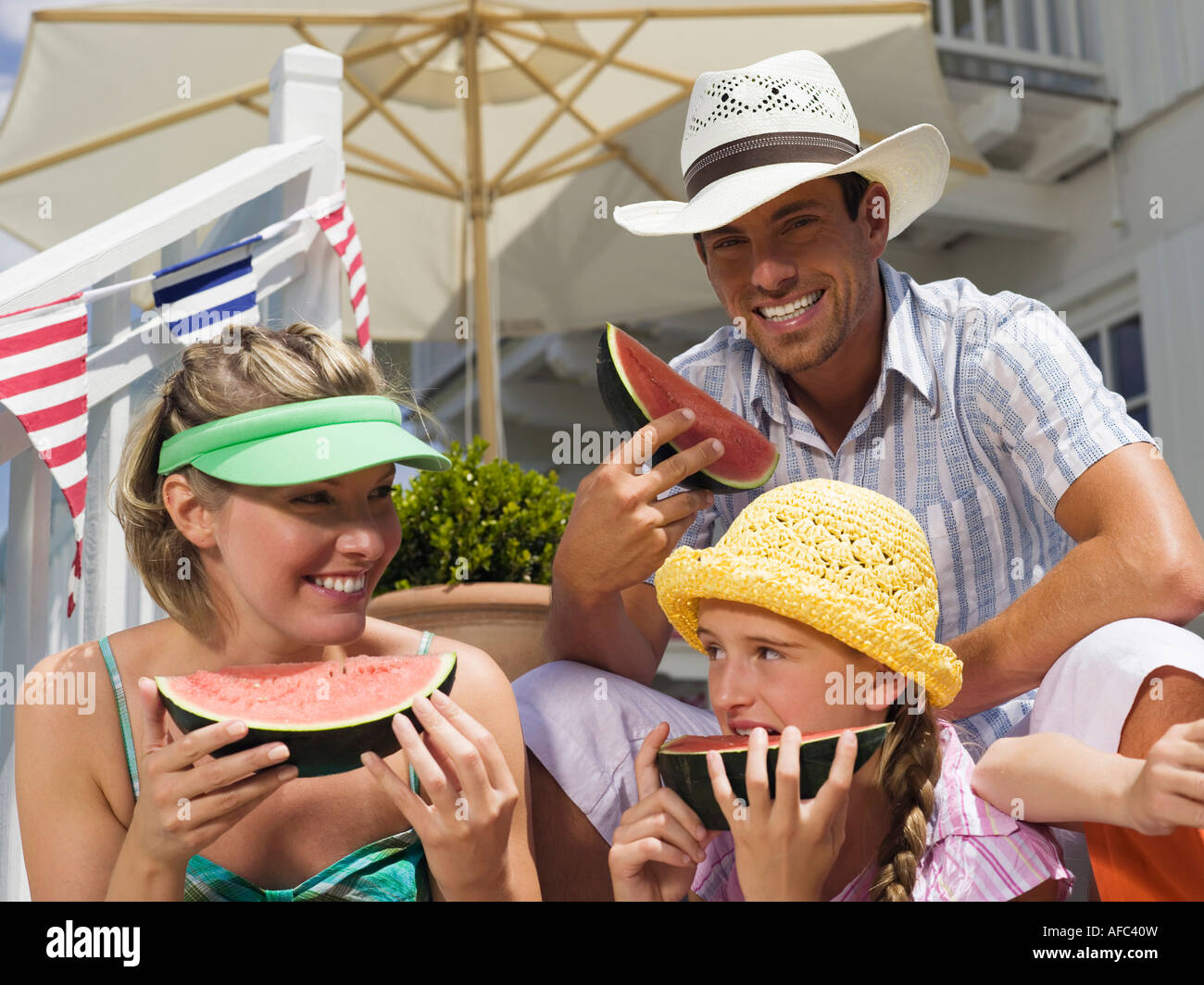 Family eating watermelon Stock Photo - Alamy