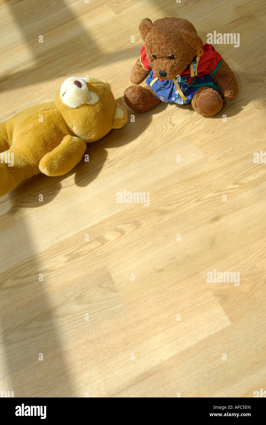 teddy bears on wooden floor Stock Photo - Alamy