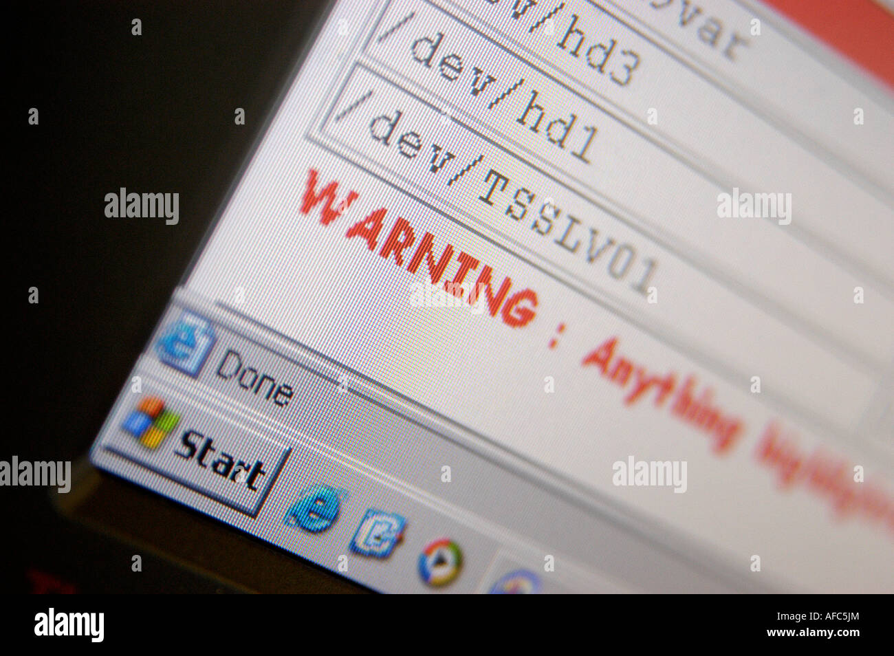 Monitor with warning message Stock Photo - Alamy