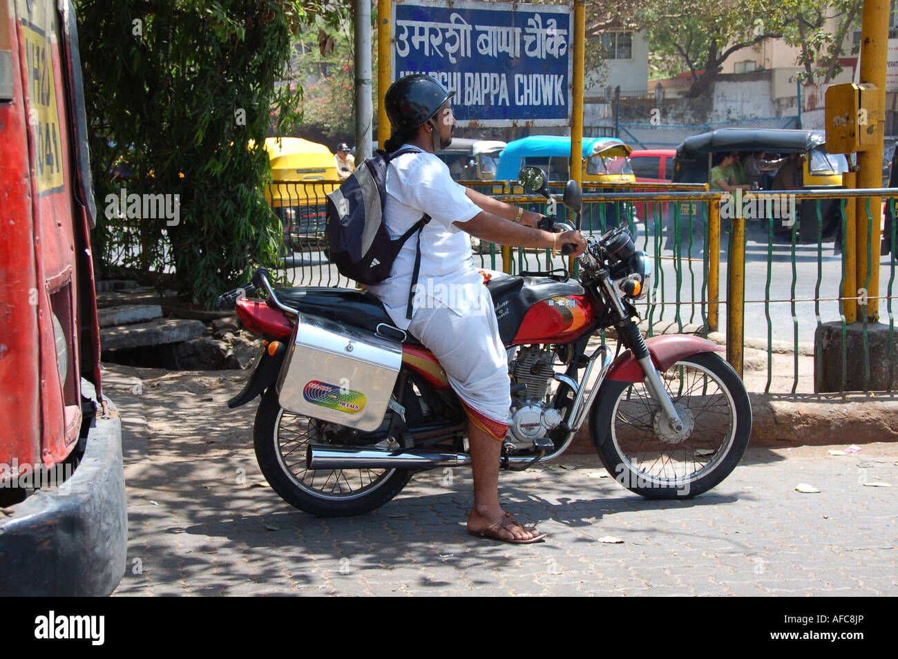 Indian priest riding on a motorbike, Mumbai, India Stock Photo - Alamy