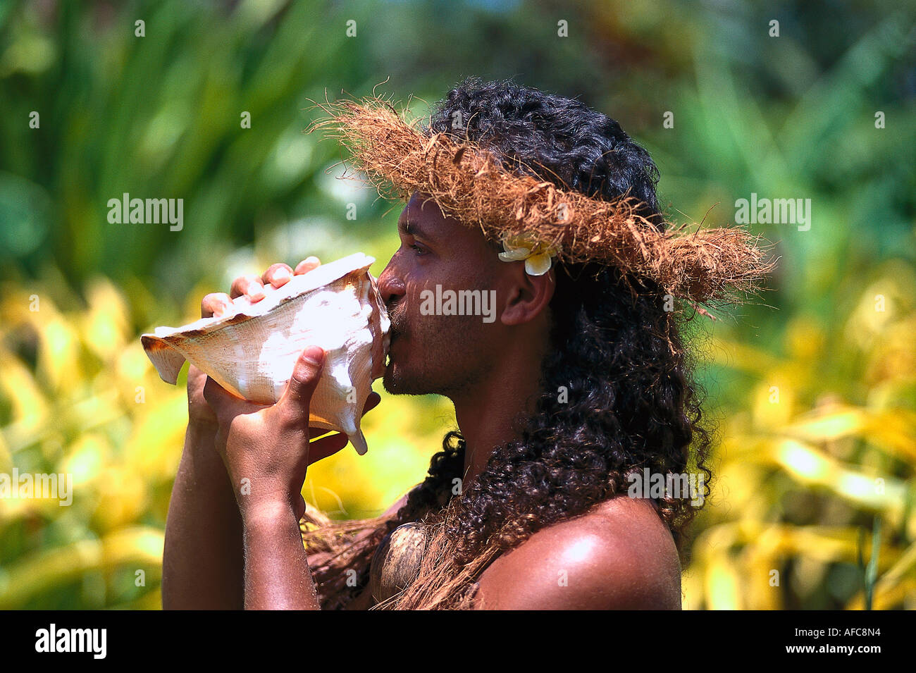 Blowing into a conch shell hi-res stock photography and images - Alamy