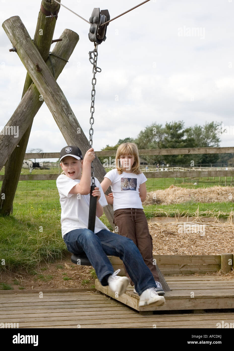 Girl on zip wire hi-res stock photography and images - Alamy