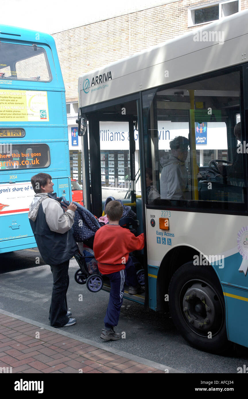 Mother struggles to get baby pram children on Bus Bangor Bus Station ...