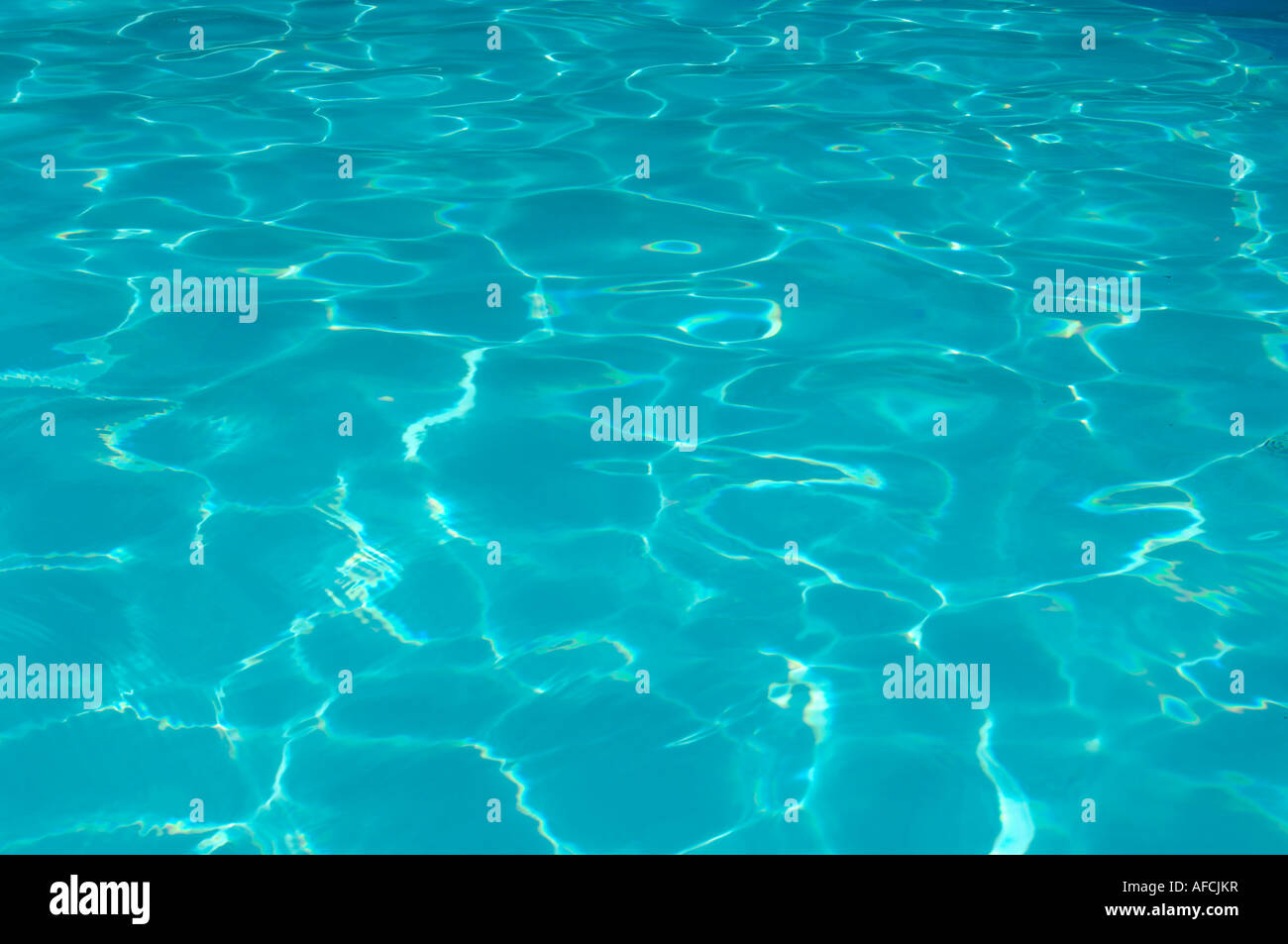 Clear blue water of swimming pool Stock Photo - Alamy