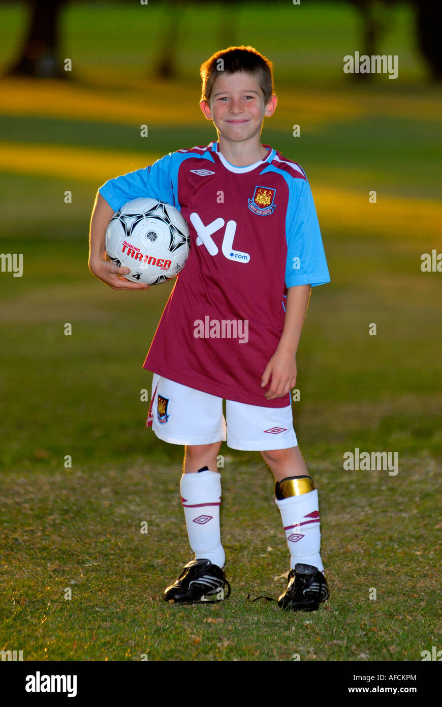 Young Boy Holding Football Stock Photo - Alamy