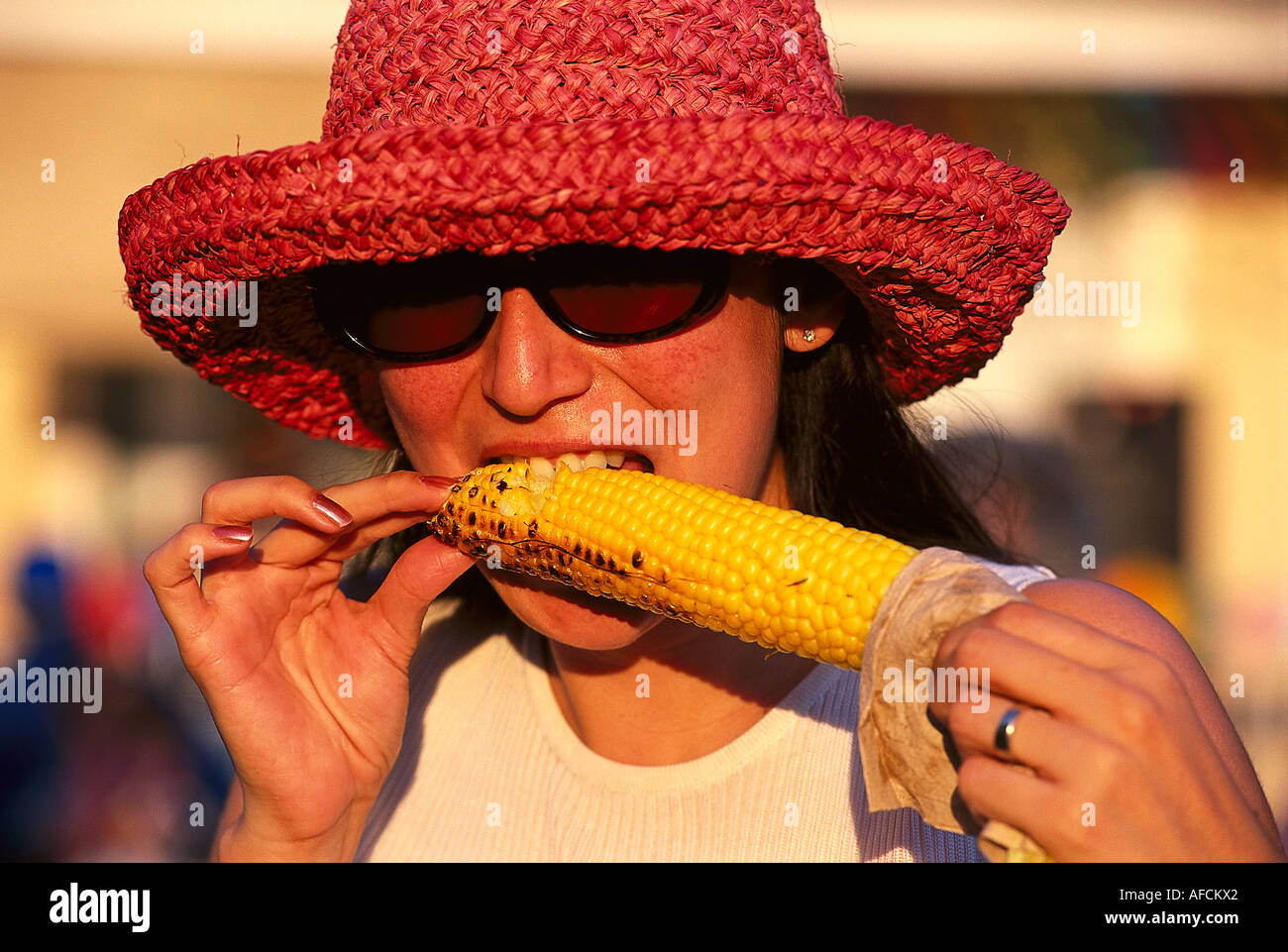 Woman with corn on the cob hi-res stock photography and images - Alamy