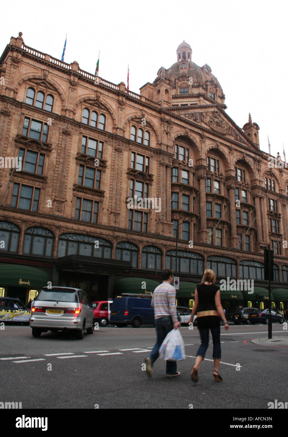 People Walking Past Harrods Store Stock Photo - Alamy