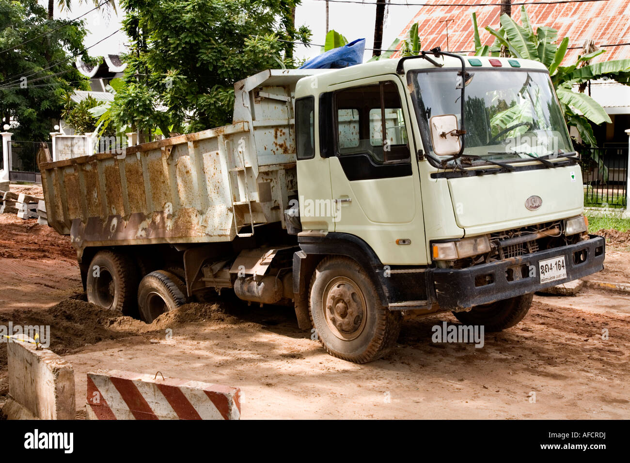 Lorry trapped in a trench during road construction in Vientiane capital ...